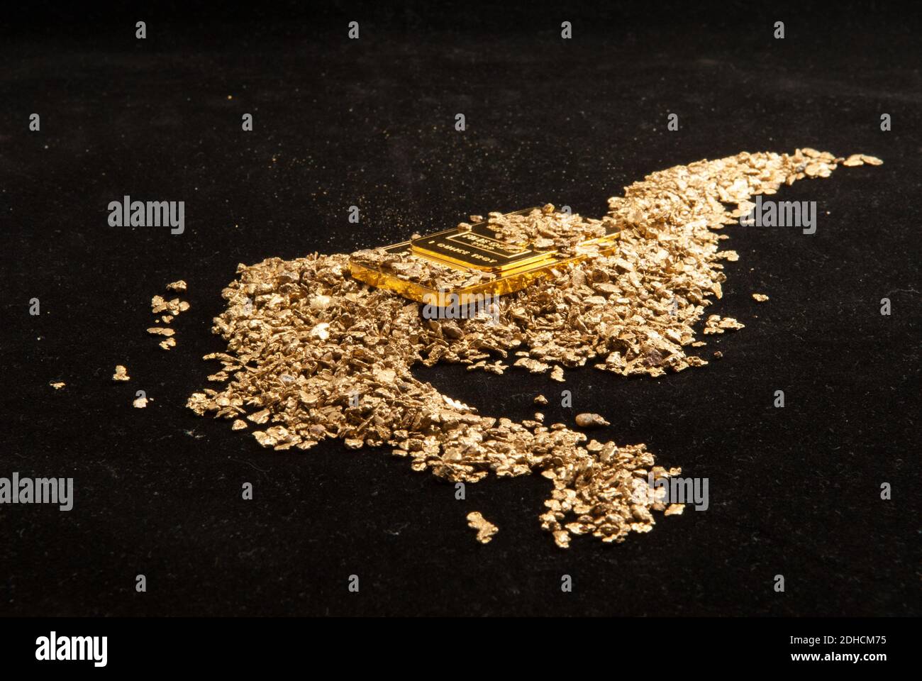 large samples of pure gold in various forms including coins, ingots ...