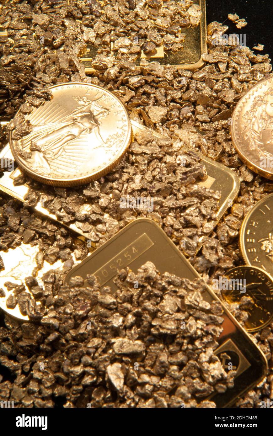 large samples of pure gold in various forms including coins, ingots ...