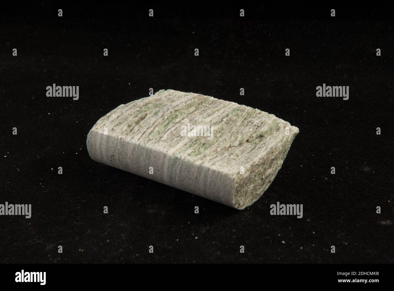 jade core sample on a black background Stock Photo - Alamy