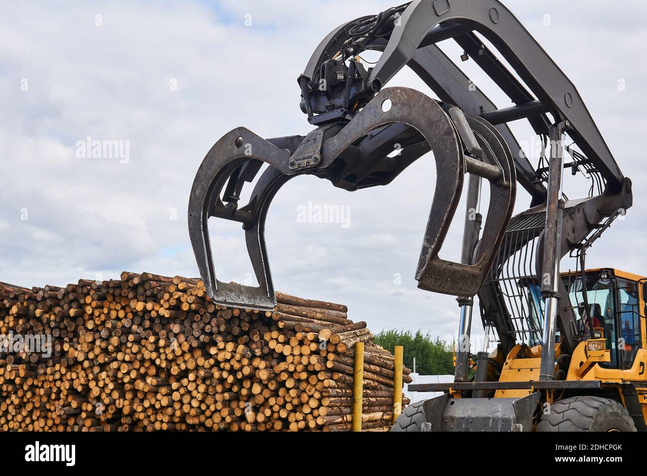 bucket a forestry grapple loader close-up against the background of a ...