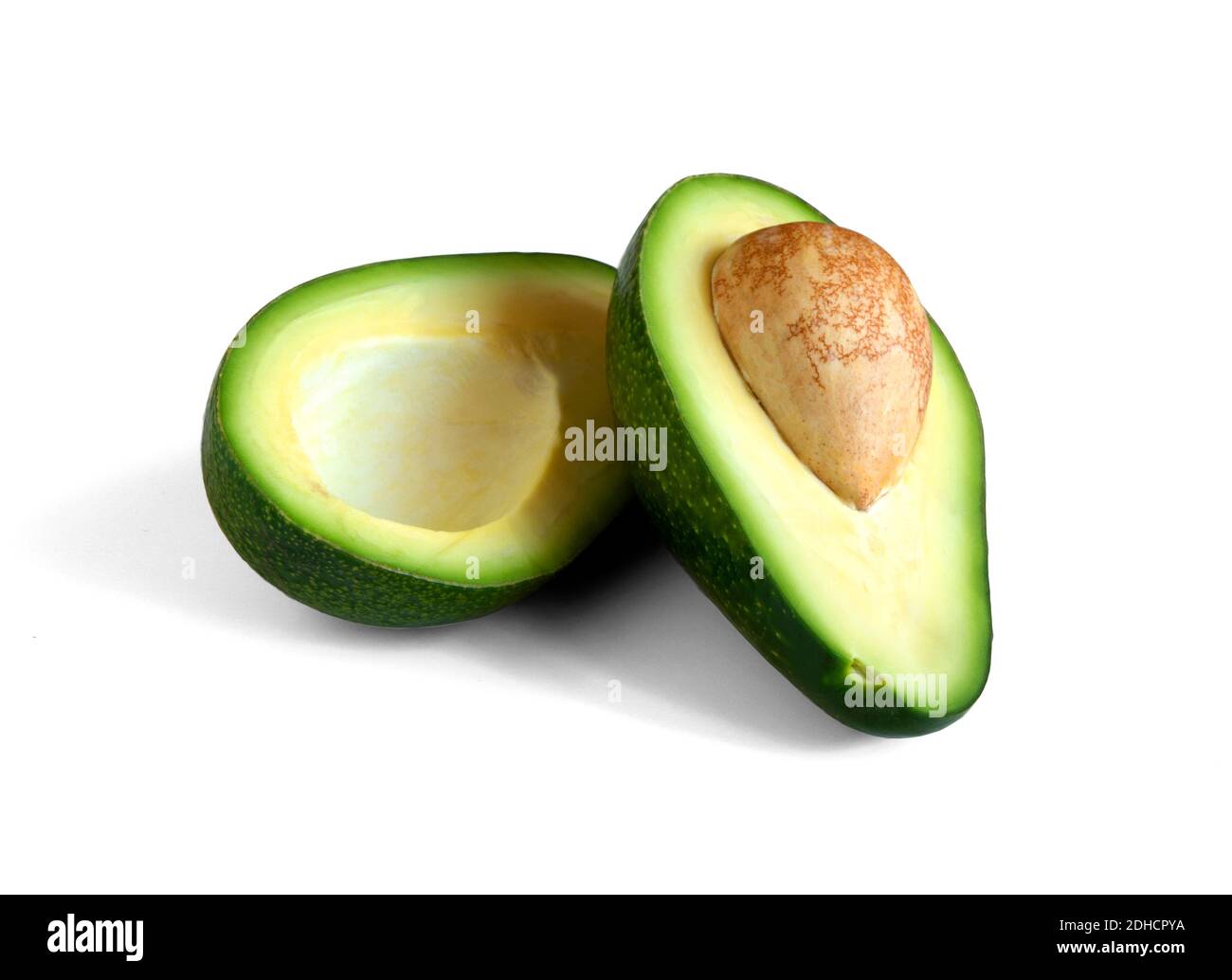 Fresh avocado cut in half Stock Photo - Alamy