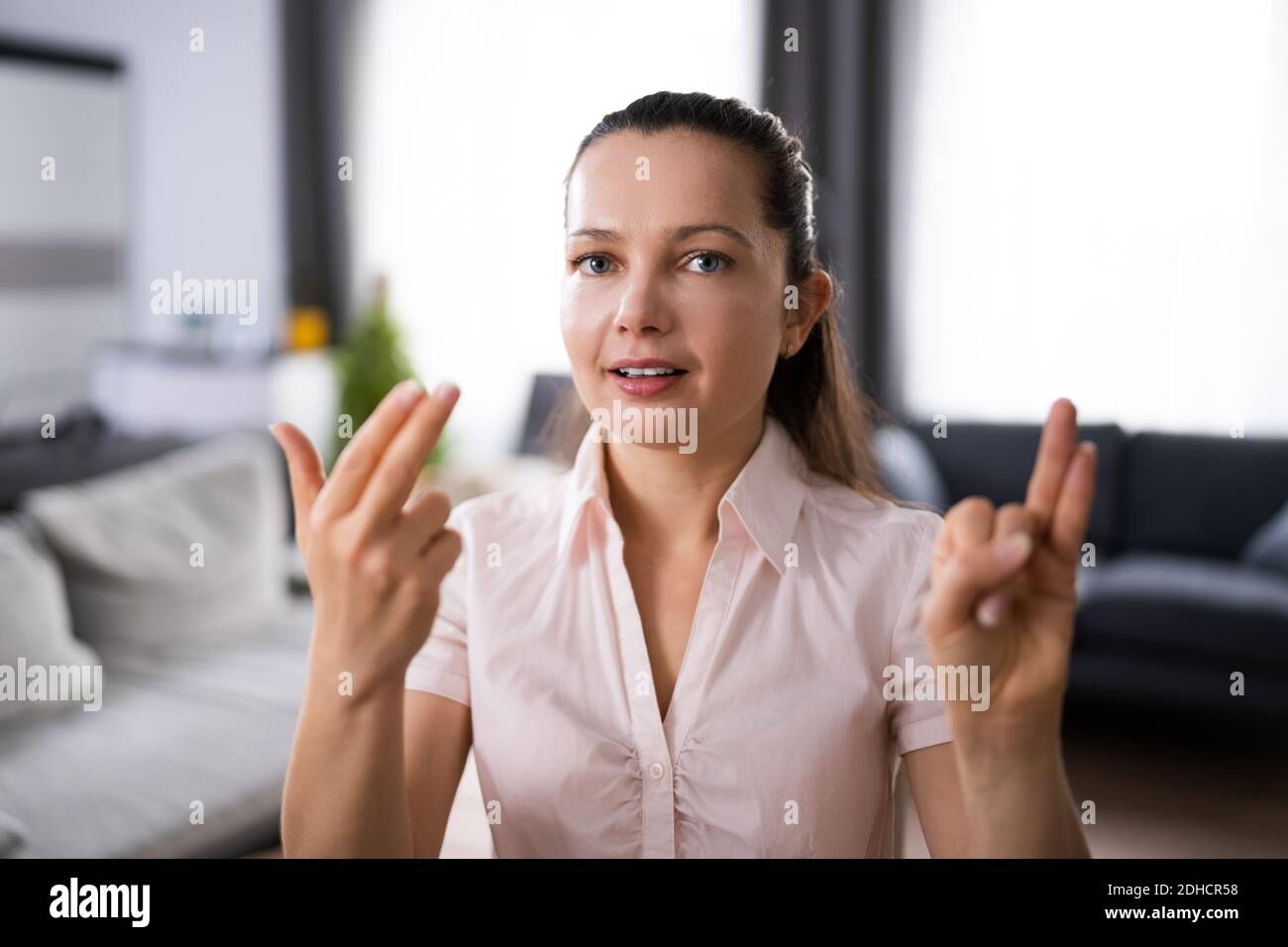 Adult Learning Sign Language For Deaf Disabled Stock Photo - Alamy