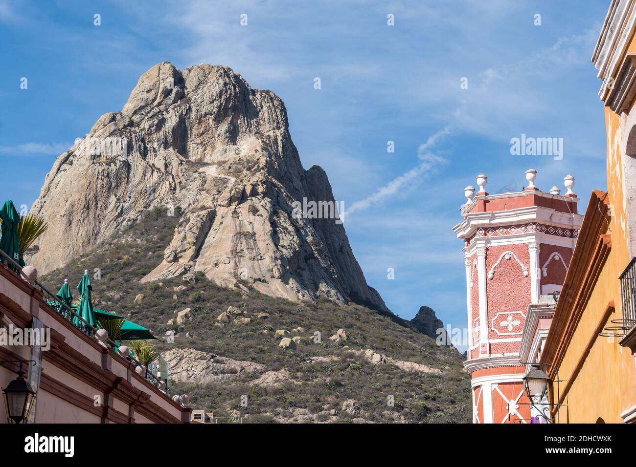 View of the Pena de Bernal monolith down the main street in the ...