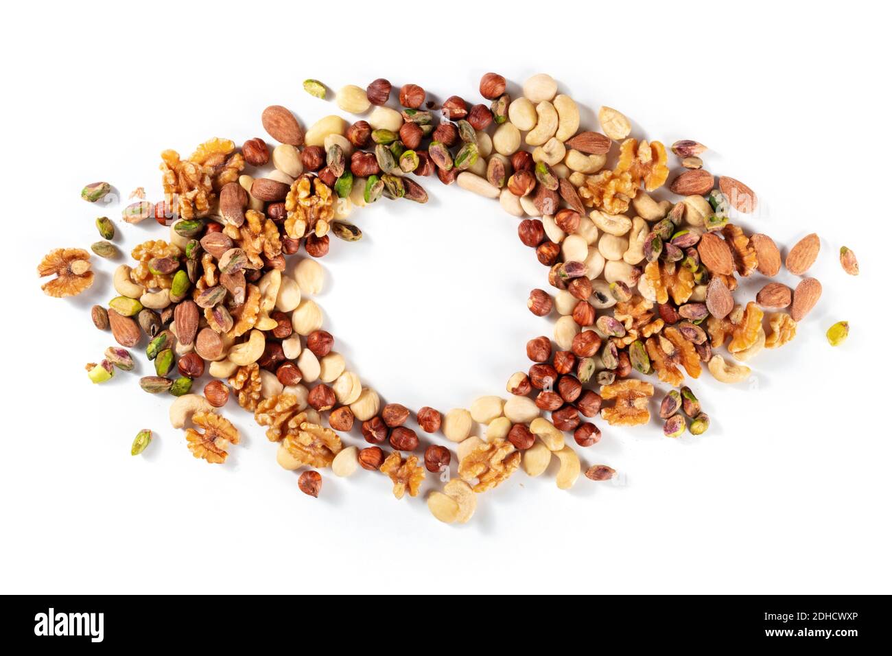 Nuts. Many nuts forming a frame for copy space, shot from the top on a ...