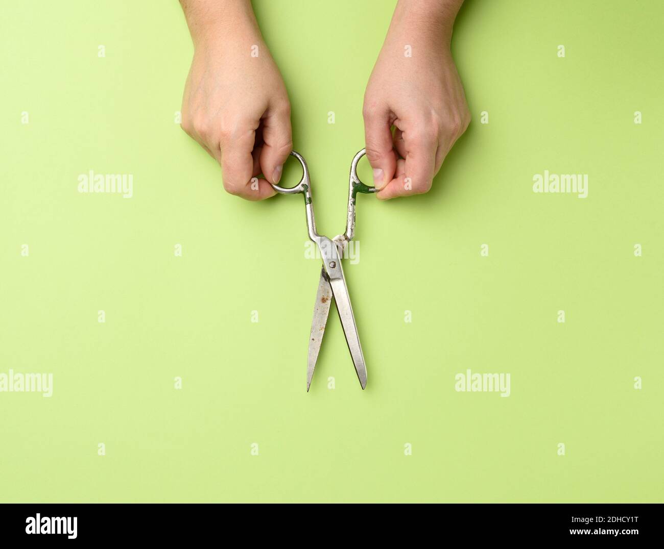 Vintage scissors hand hi-res stock photography and images - Alamy