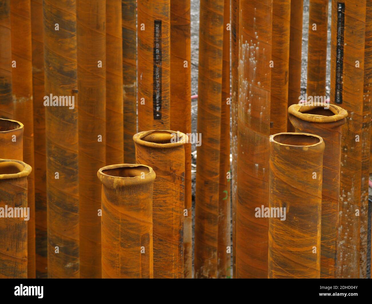 piling driven deeply into the ground in advance of a new building going ...