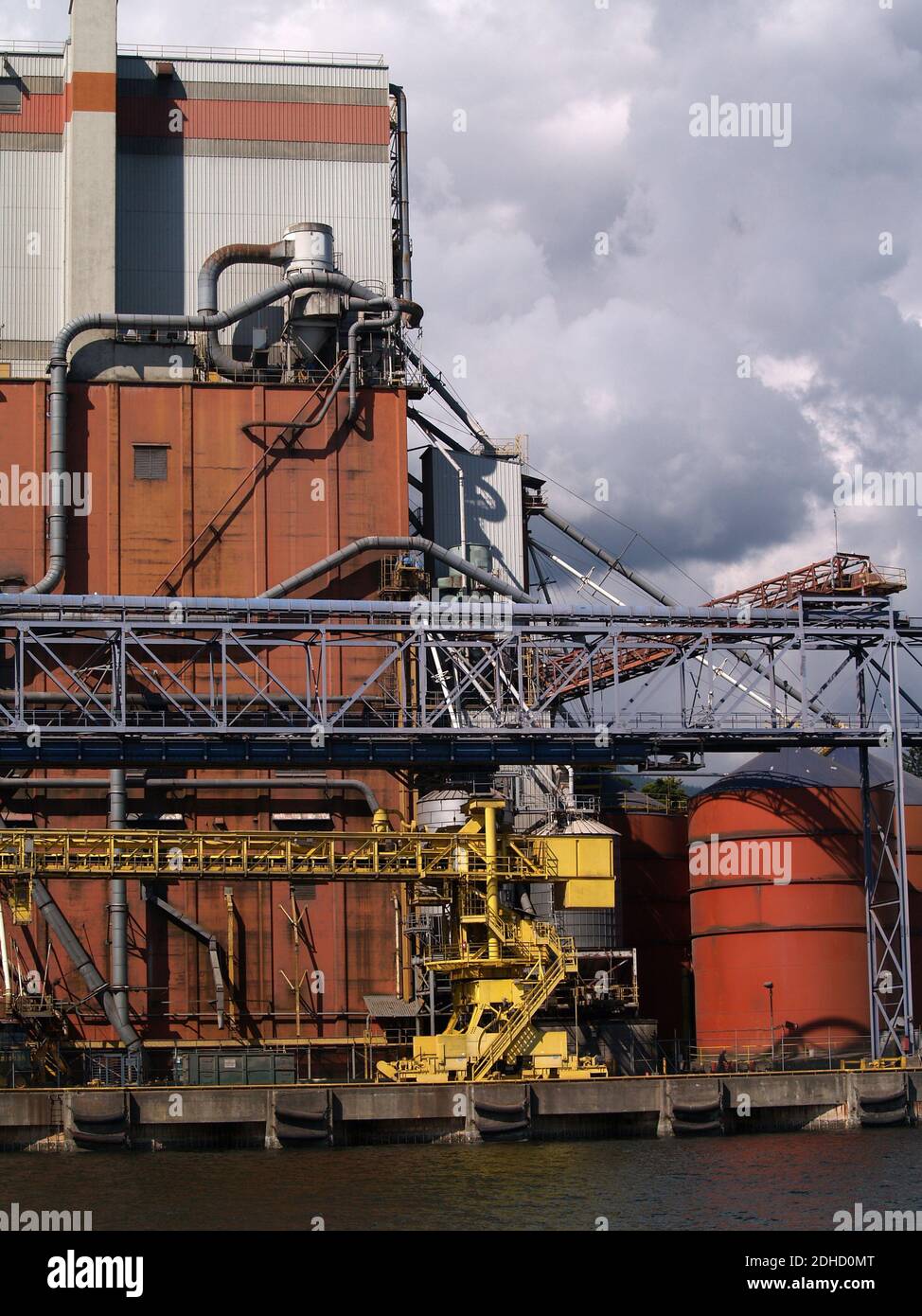 a large chemical plant in a busy harbor Stock Photo - Alamy