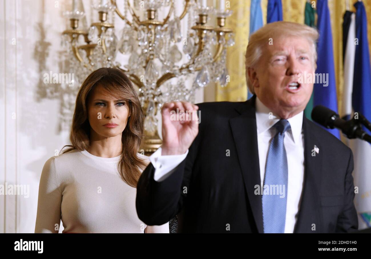 U.S. President Donald Trump speaks as First Lady Melania Trump looks on ...