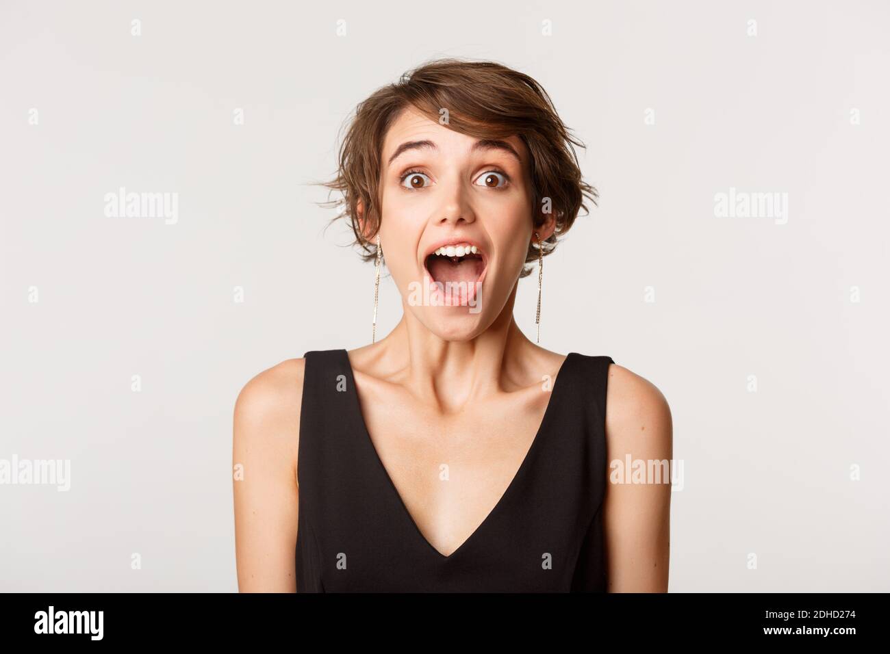 Close-up of ecstatic amazed girl drop jaw and looking impressed at ...