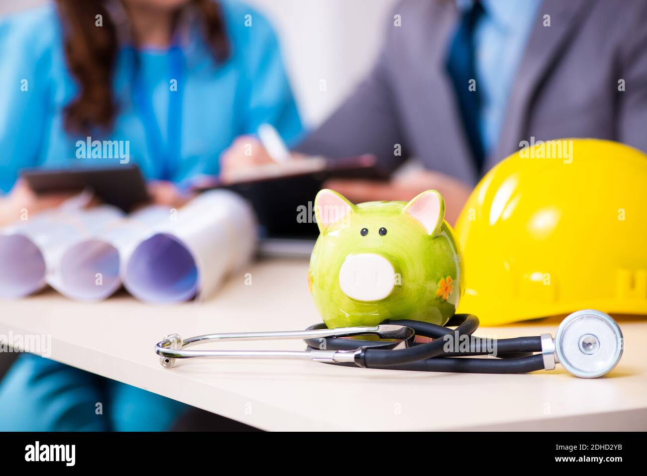 Young businessman and female doctor discussing construction proj Stock ...