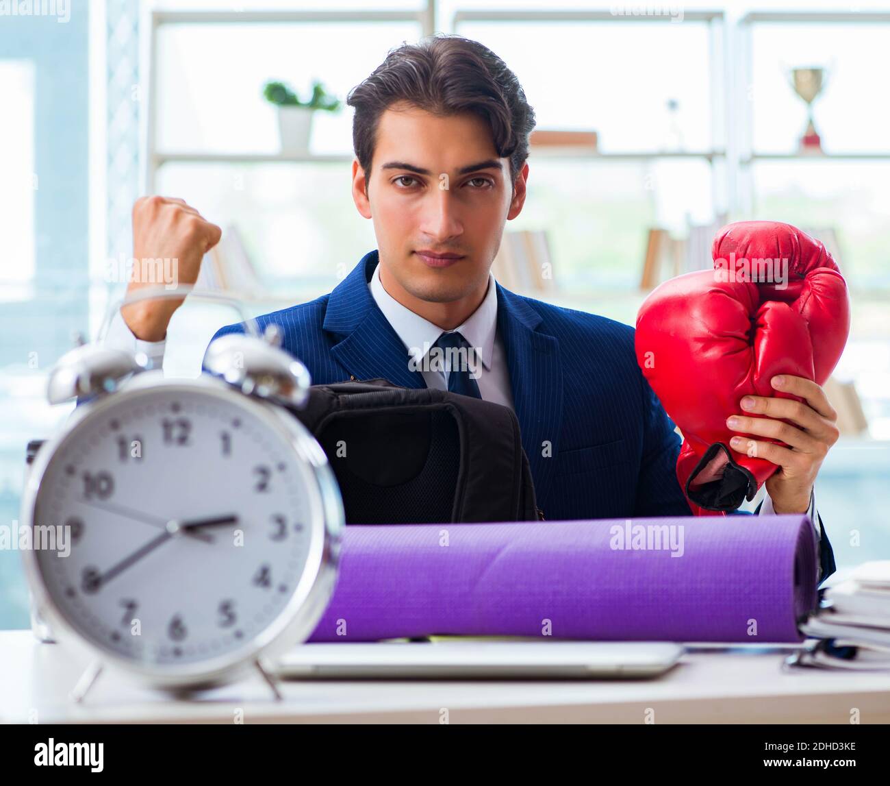 Man with boxing gloves in the office Stock Photo - Alamy