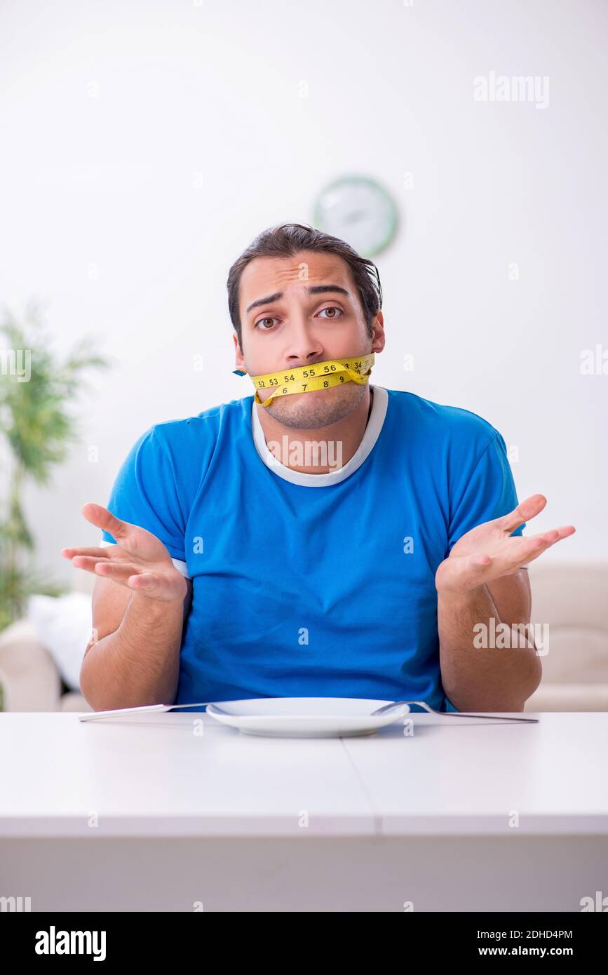 Angry man waiting food in hi-res stock photography and images - Alamy