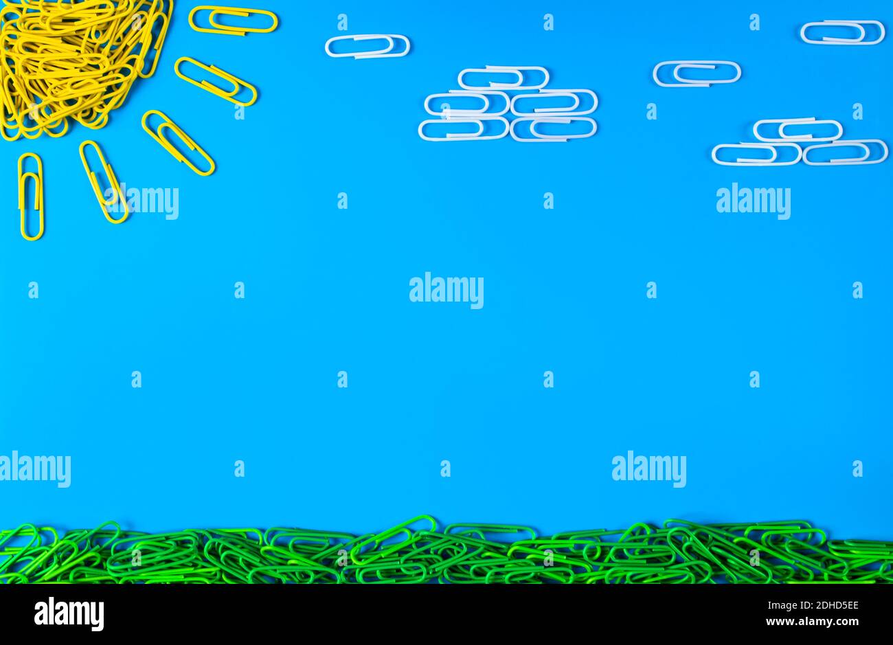 Made of colored bright paper clips on blue background,top view with ...