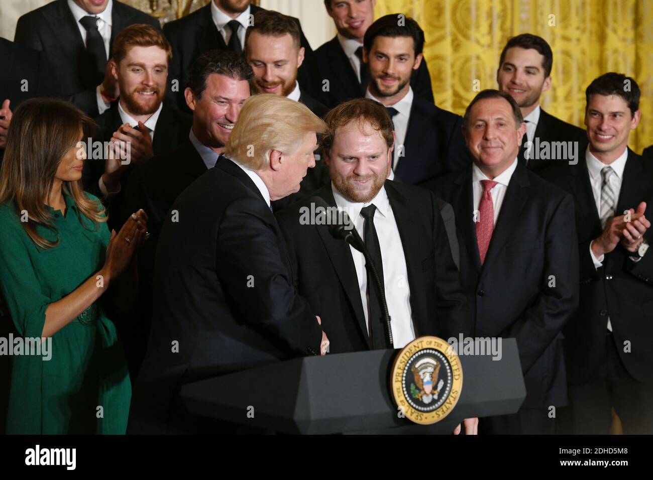 U.S. President Donald Trump checks hands with Penguins' Sidney Crosby ...