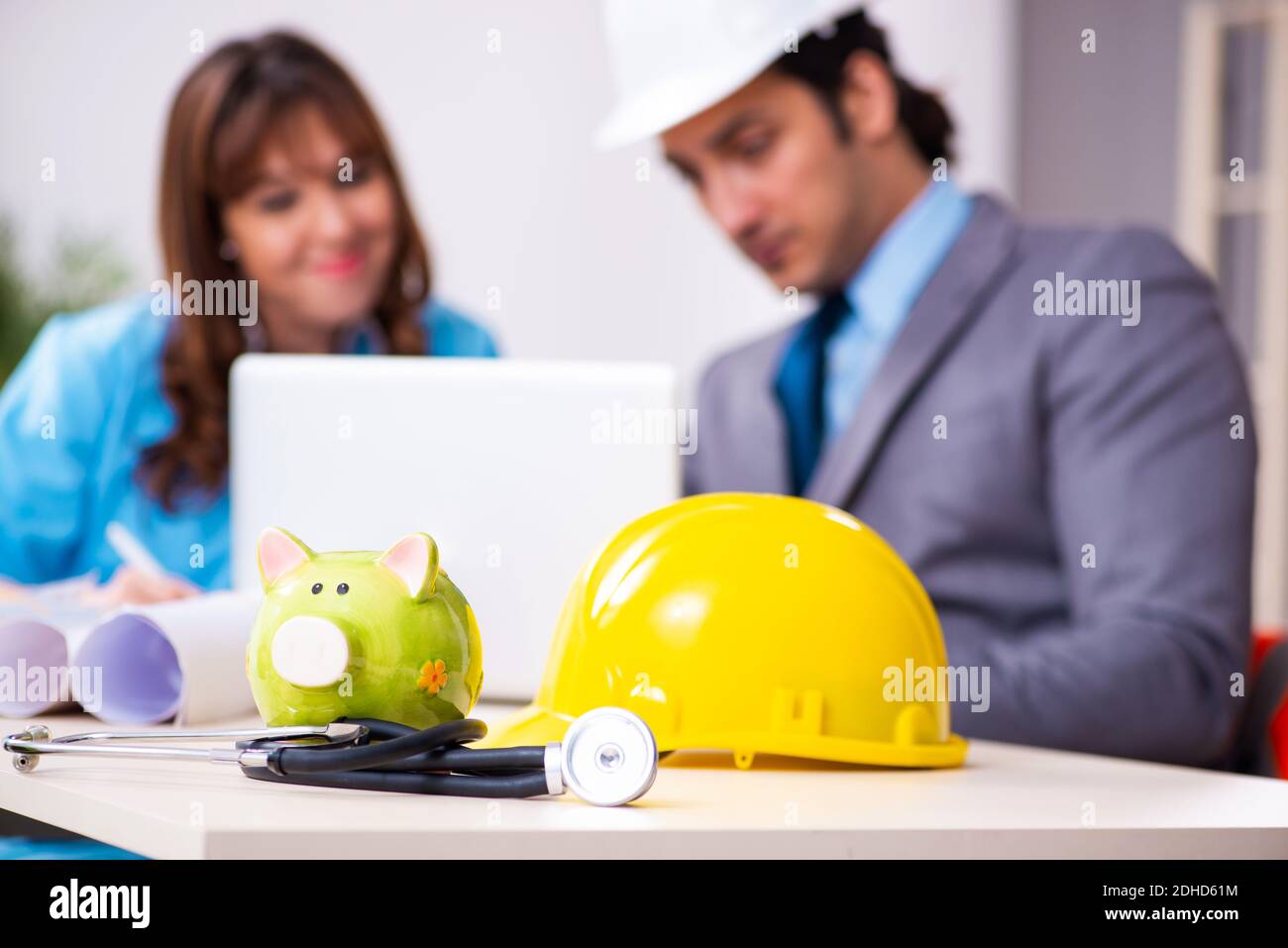 Young businessman and female doctor discussing construction proj Stock ...