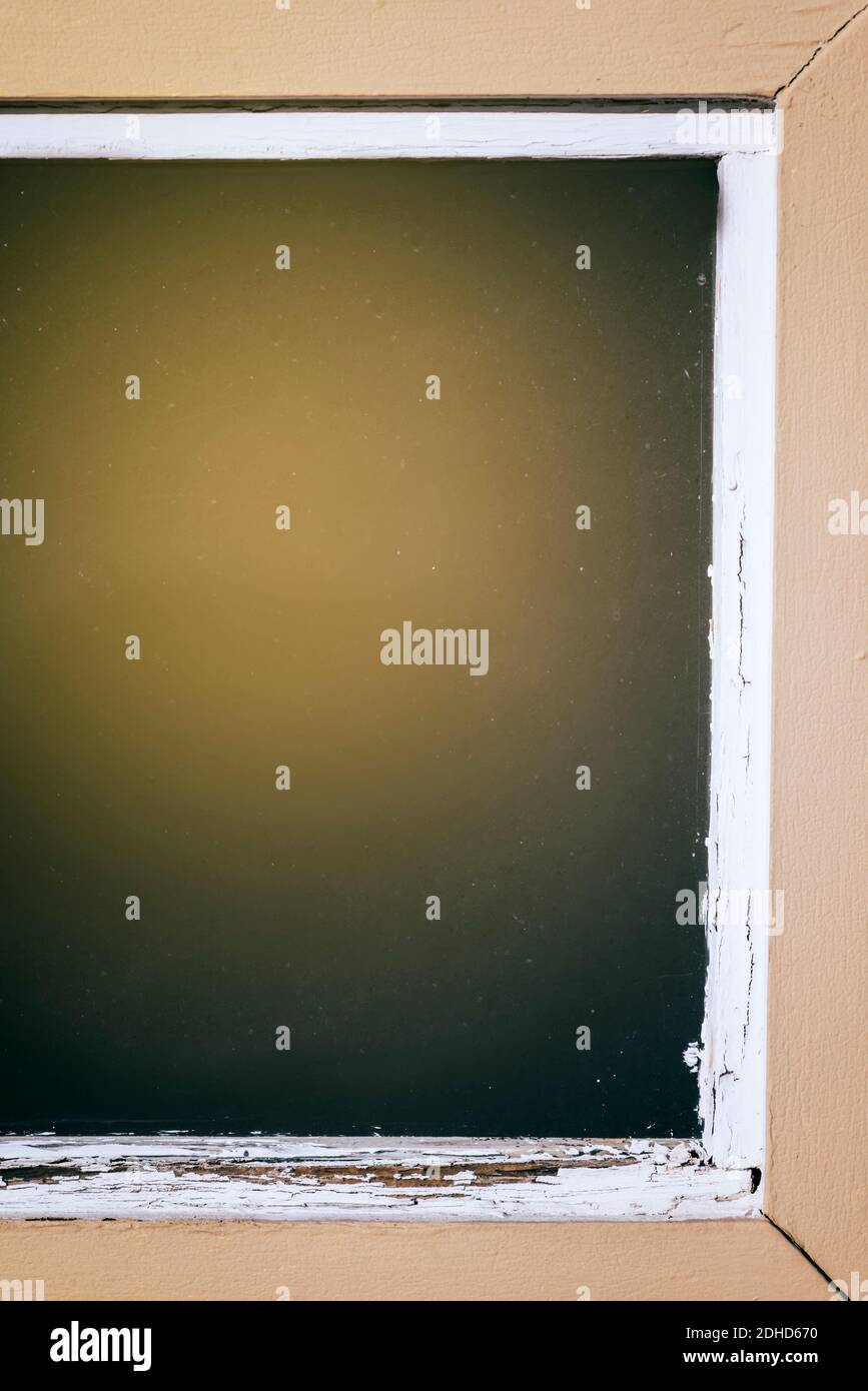 Dark window on old built structure with lens flare or light effect ...