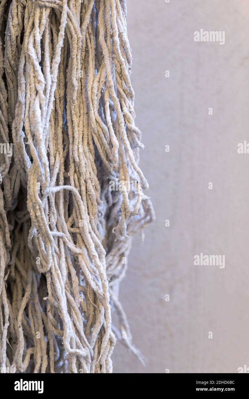 A close up of a mop hanging on a line Stock Photo - Alamy