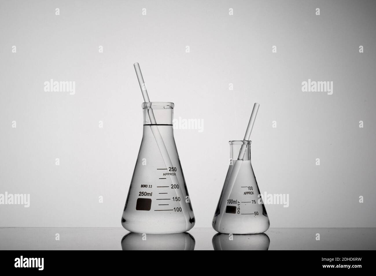 A closeup shot of tubes inside Erlenmeyer beakers Stock Photo - Alamy