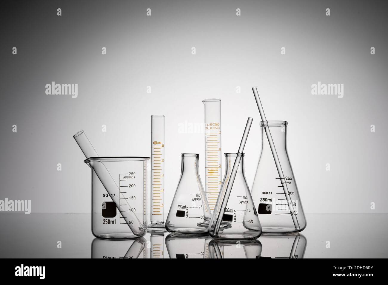 A closeup shot of transparent laboratory flasks, beakers, and tubes ...