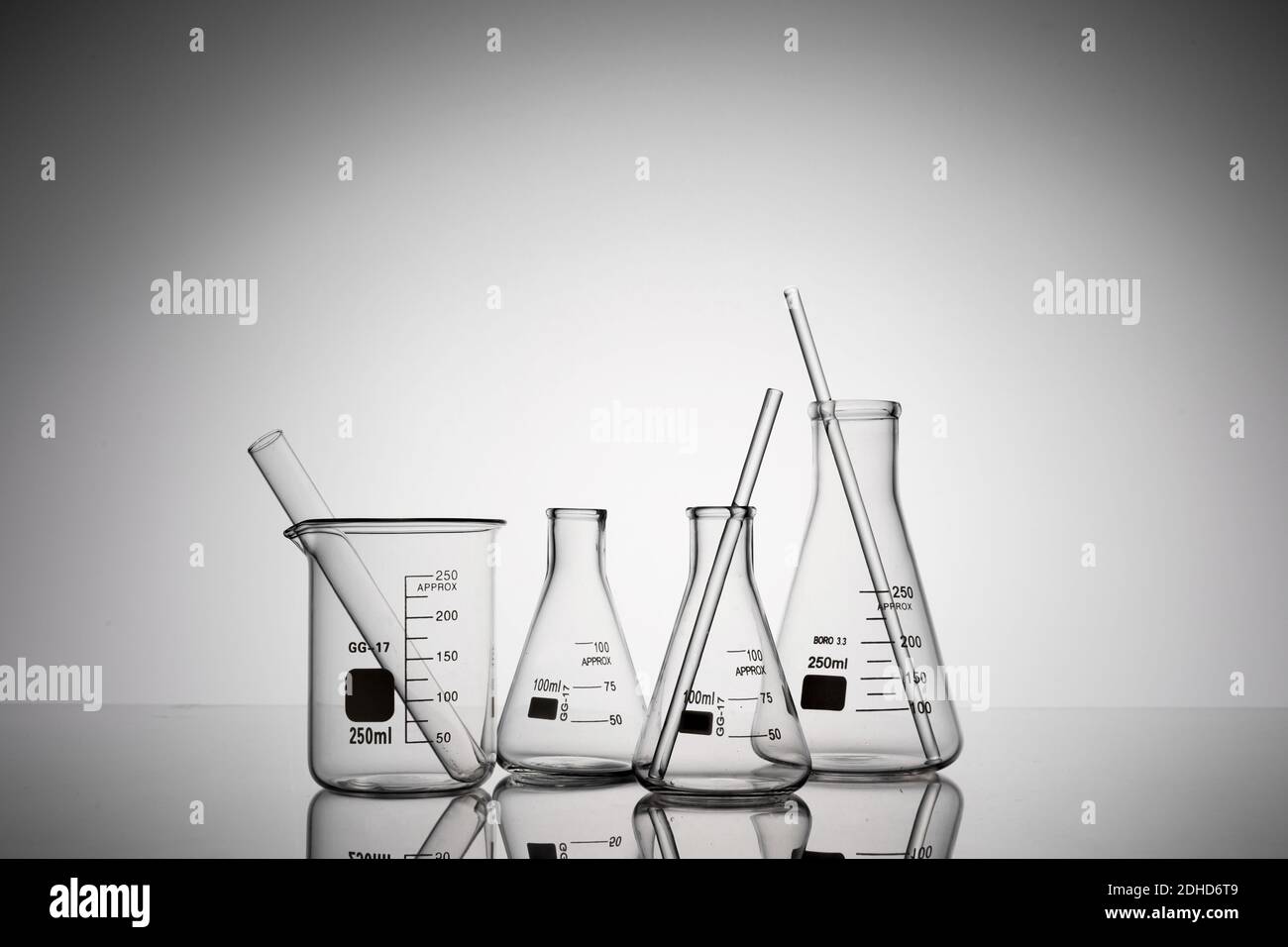A closeup shot of transparent laboratory flasks, beakers, and tubes ...