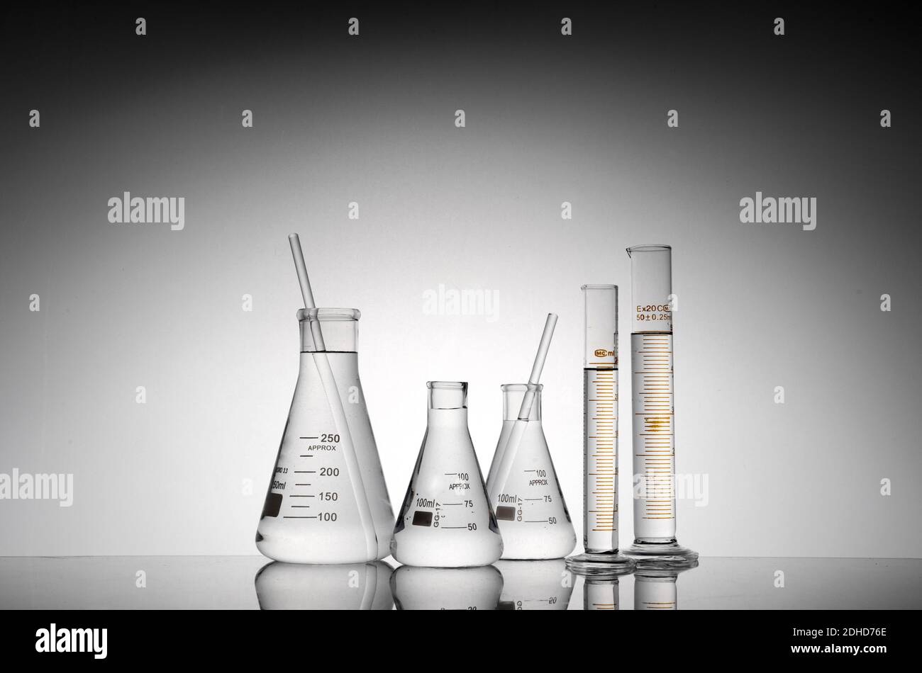 A closeup shot of transparent laboratory flasks, beakers, and tubes ...