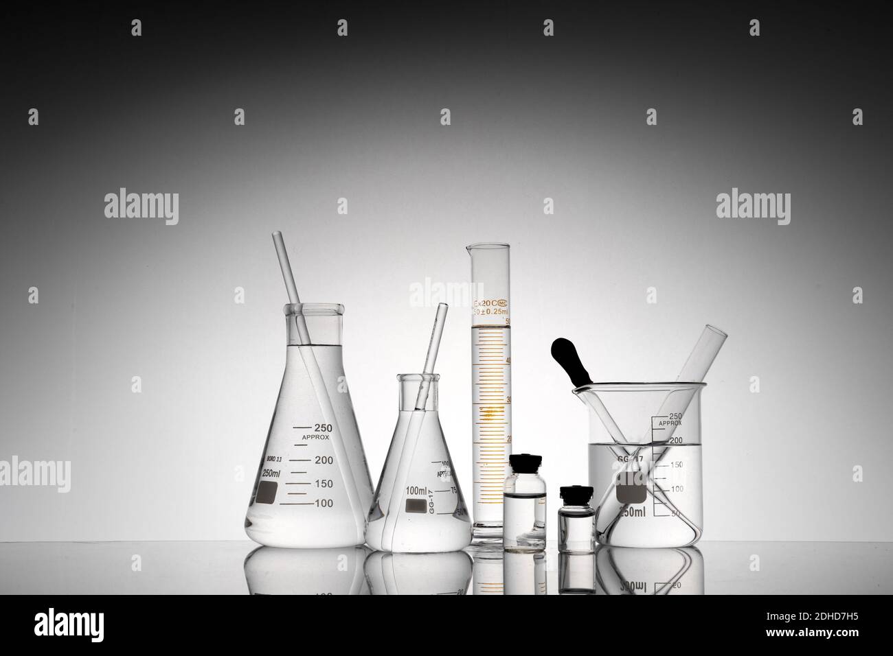 A closeup shot of transparent laboratory flasks, beakers, and tubes ...