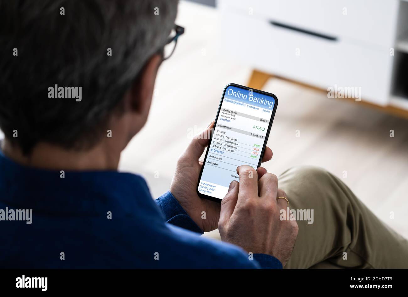 Man Using Mobile Phone Checking Bank Statement Online Stock Photo - Alamy