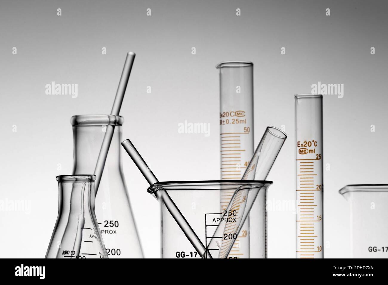 A closeup shot of transparent laboratory flasks, beakers, and tubes ...