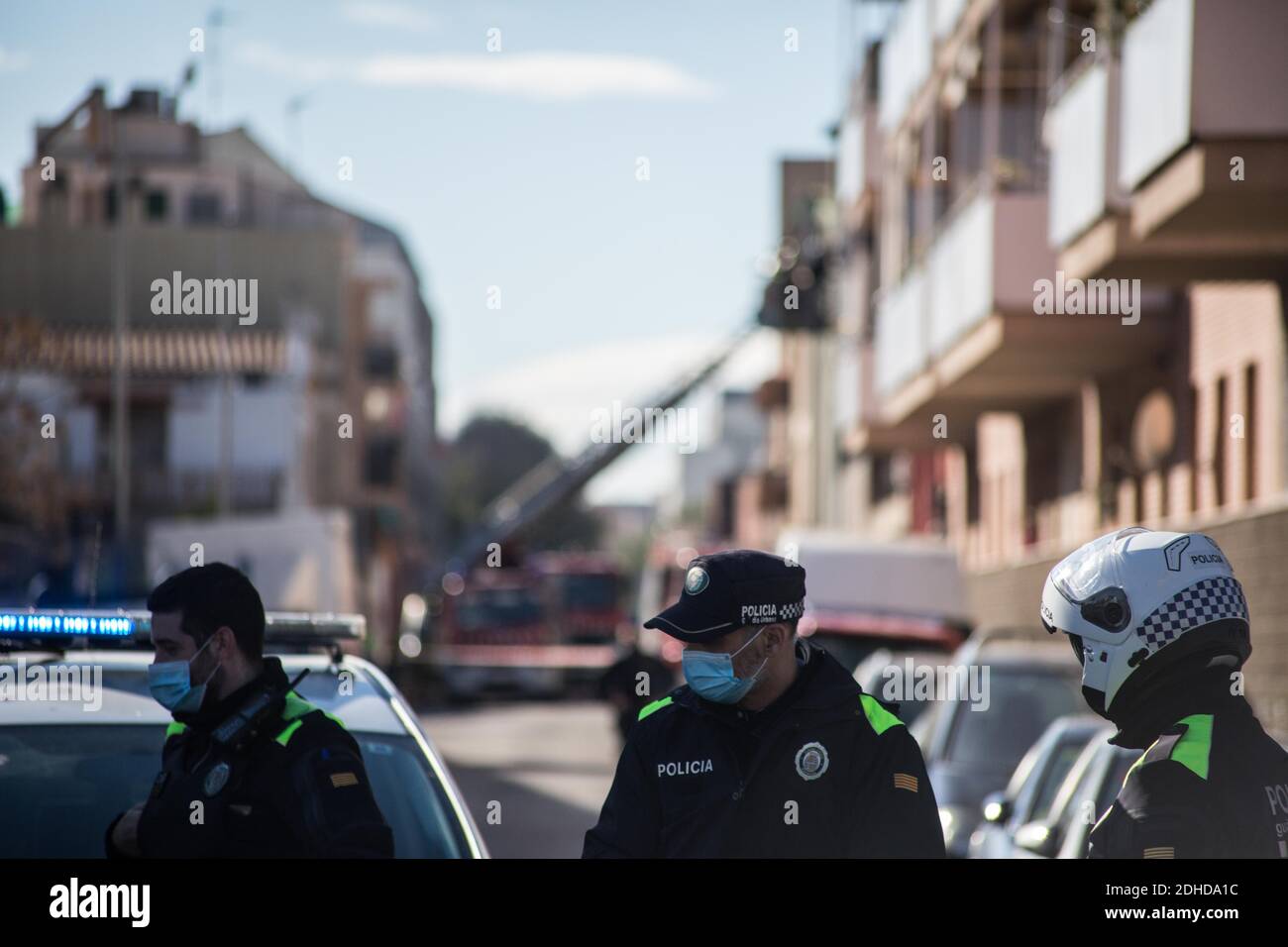 Police taping off the accident scene for firefighters to work, during ...