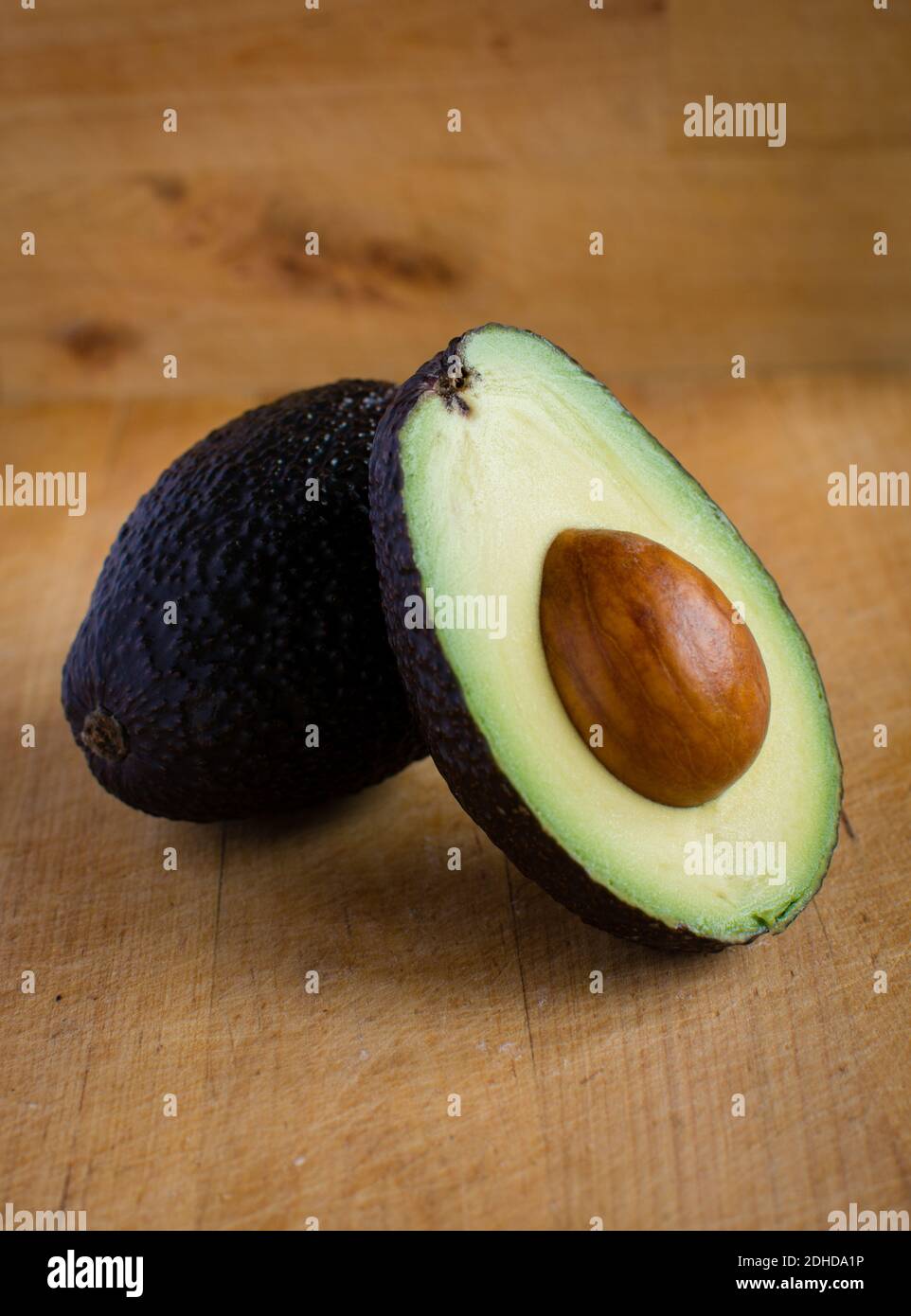 A fresh avocado cut in half Stock Photo - Alamy