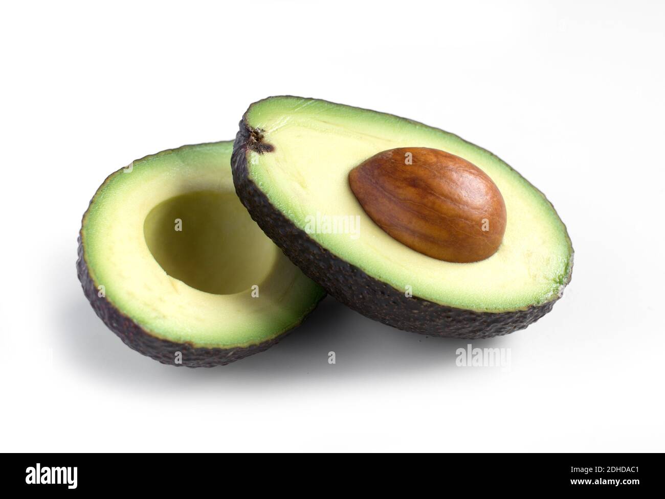 A fresh avocado cut in half Stock Photo - Alamy