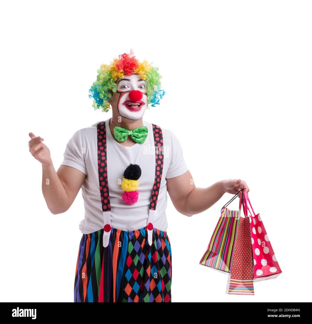 Funny clown with shopping bags isolated on white background Stock Photo ...