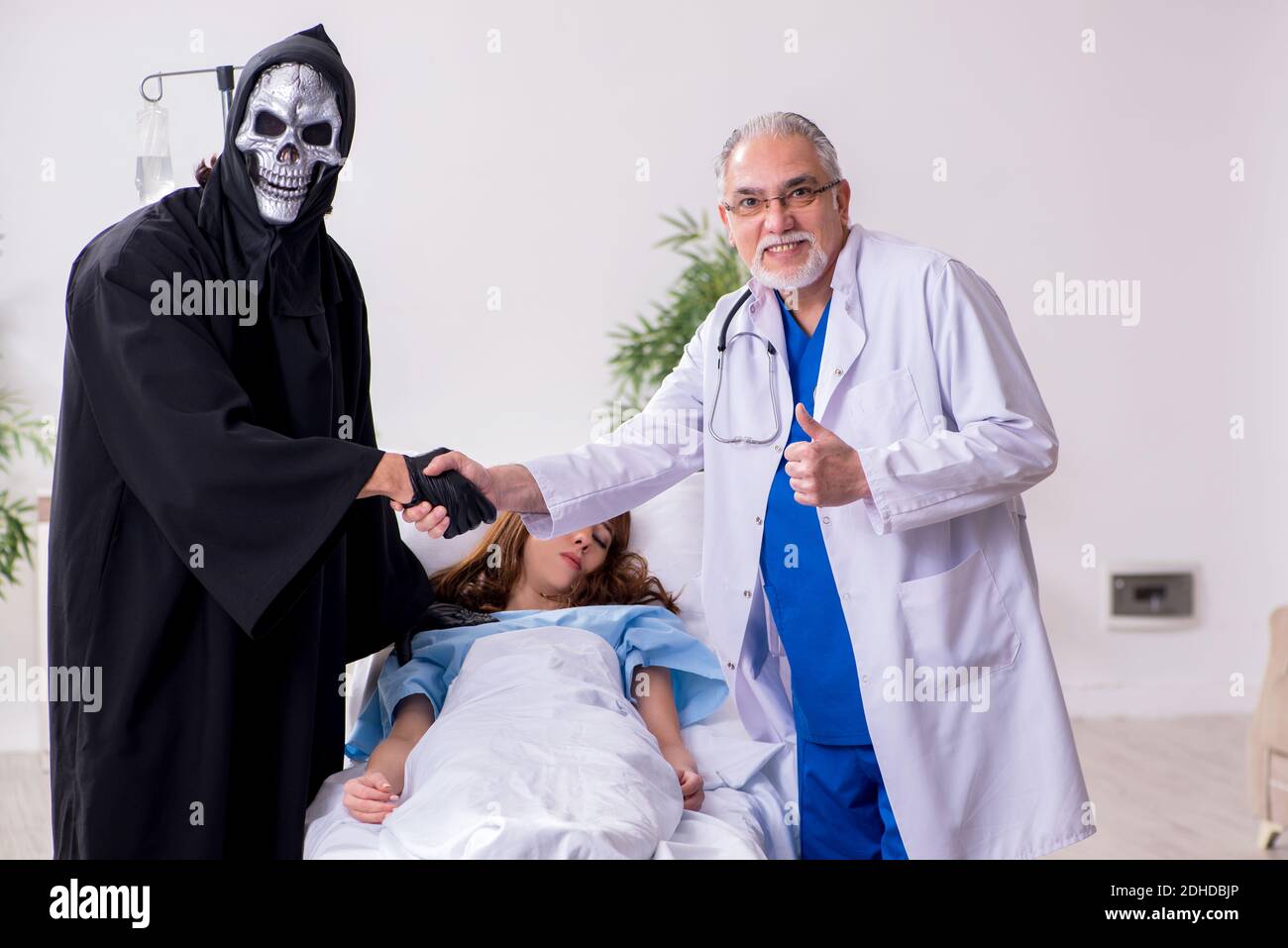 Devil, old doctor and female patient in the clinic Stock Photo - Alamy