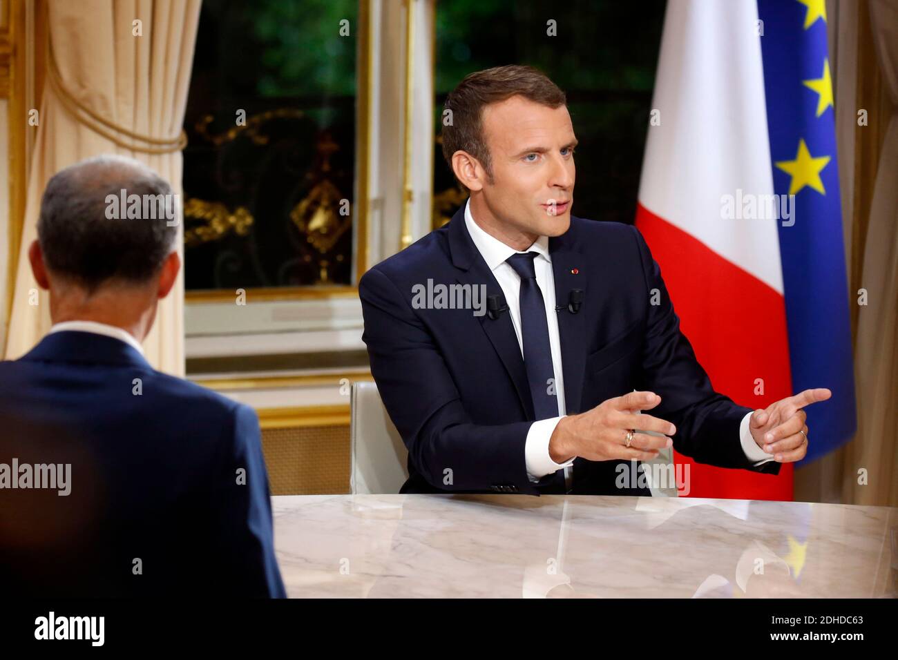 French President Emmanuel Macron is seen before his first long live ...