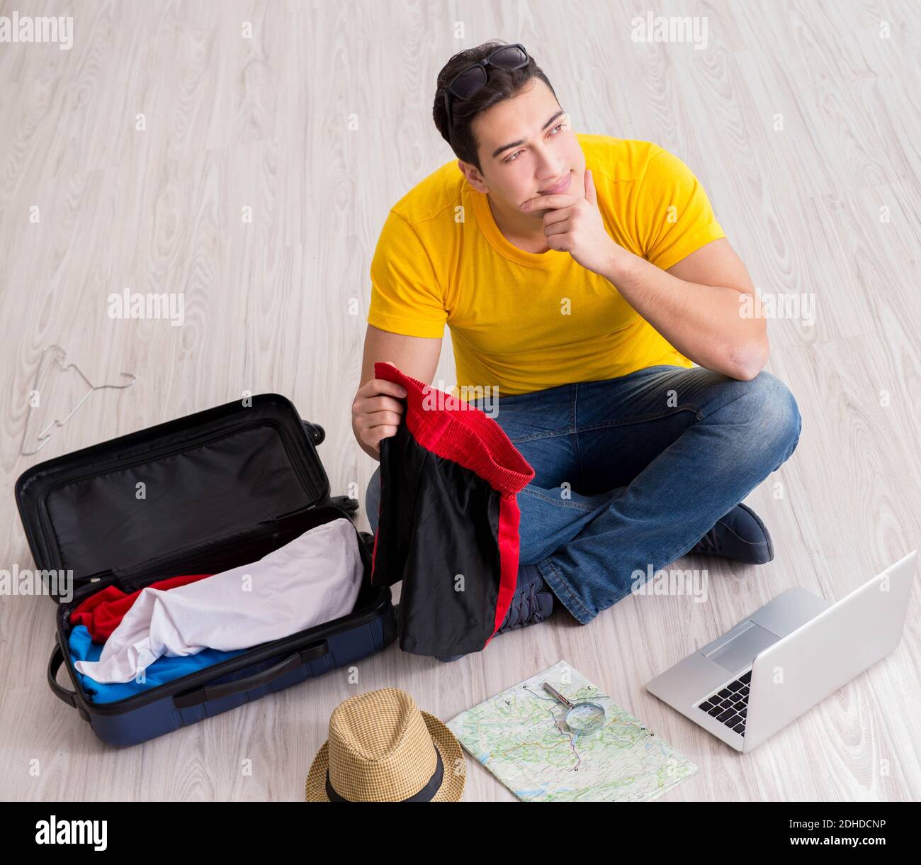 Man planning his vacation trip with map Stock Photo - Alamy
