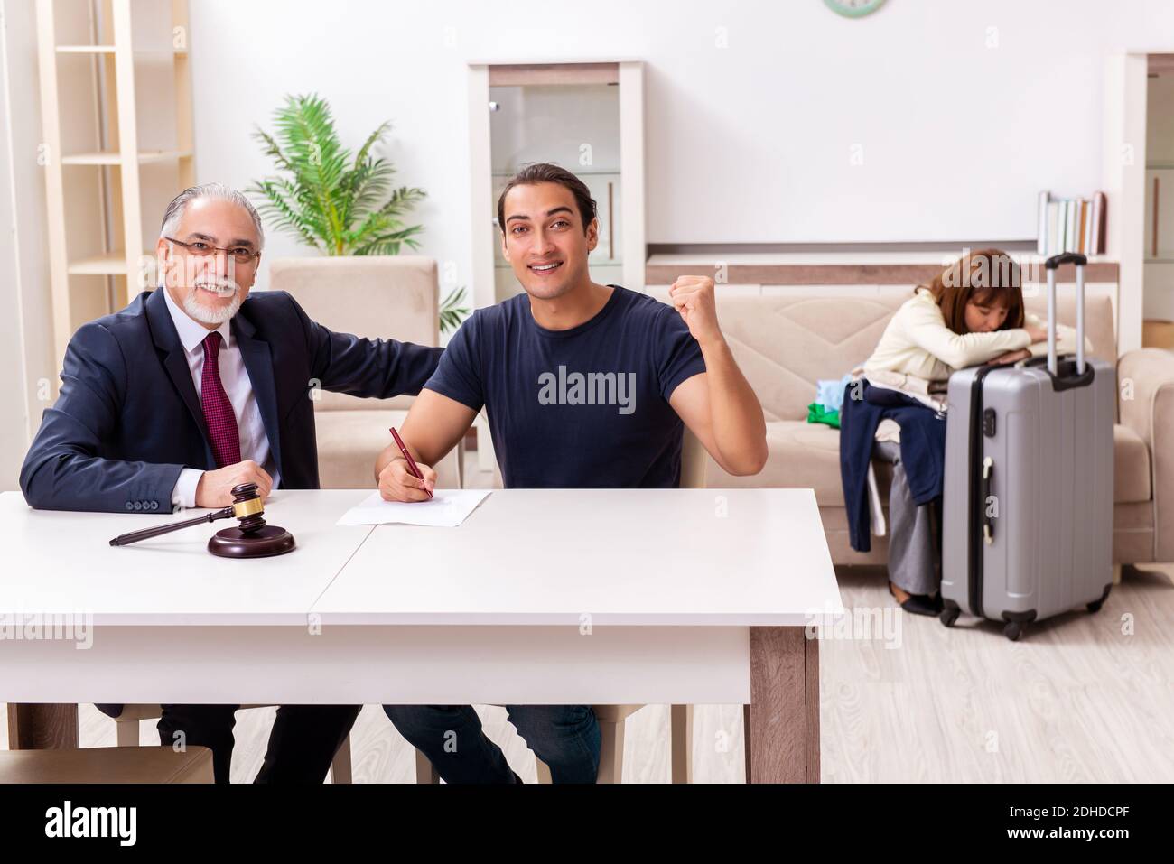 Old experienced judge and young couple in divorcing concept Stock Photo ...