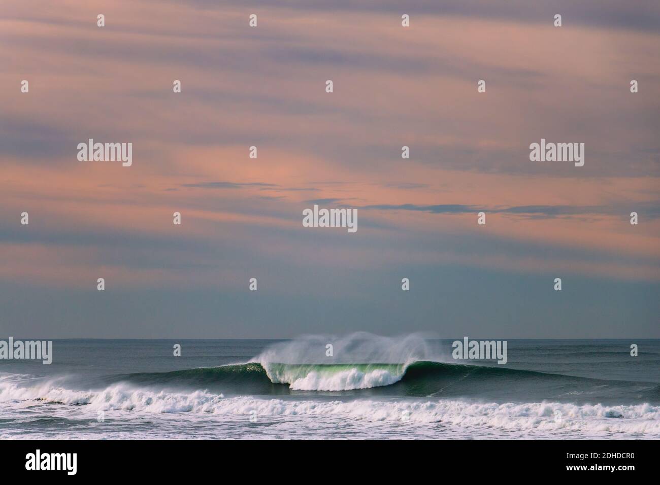 A big wave breaks in the Pacific Ocean on a California beach Stock ...