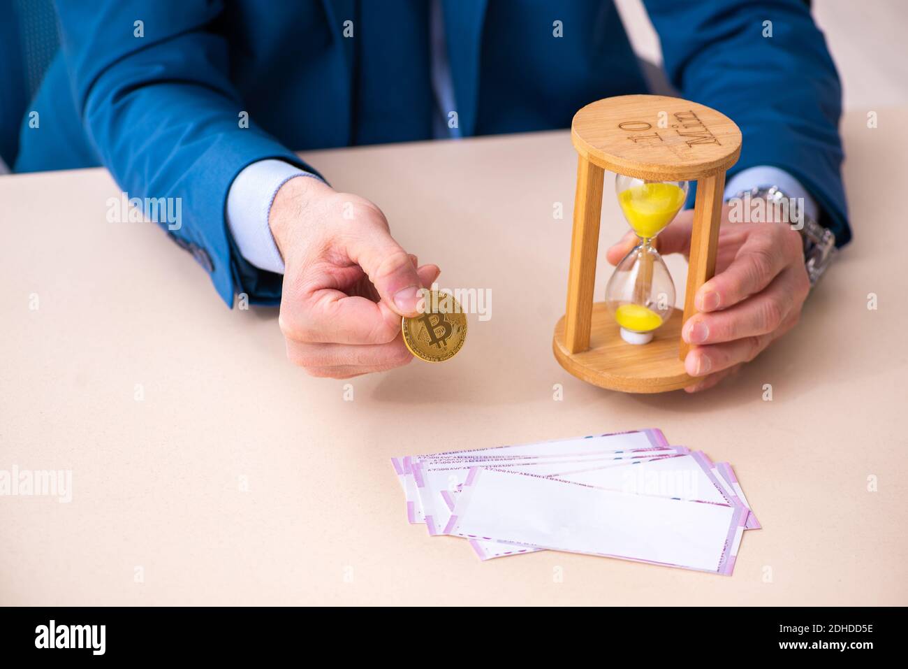 Old man earning money via Internet in time management concept Stock ...