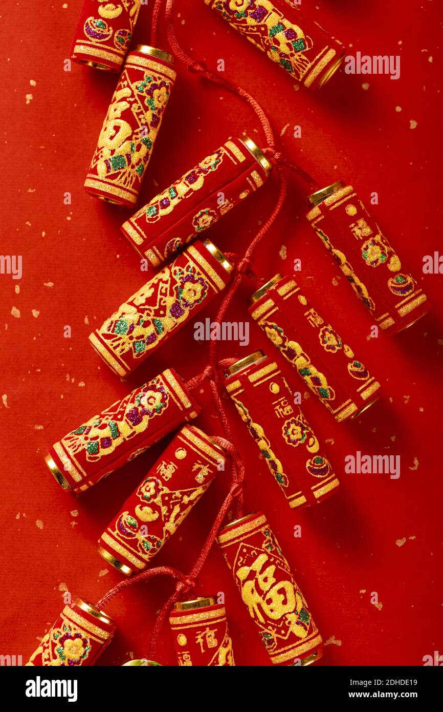 A vertical shot of firecrackers on red background Stock Photo - Alamy
