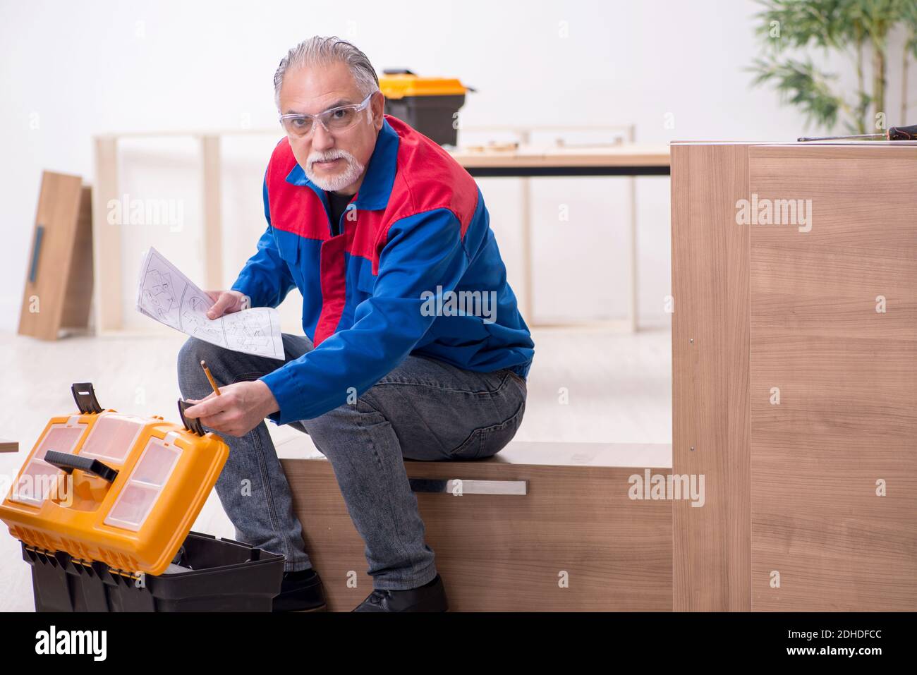 Old carpenter working indoors hi-res stock photography and images - Alamy