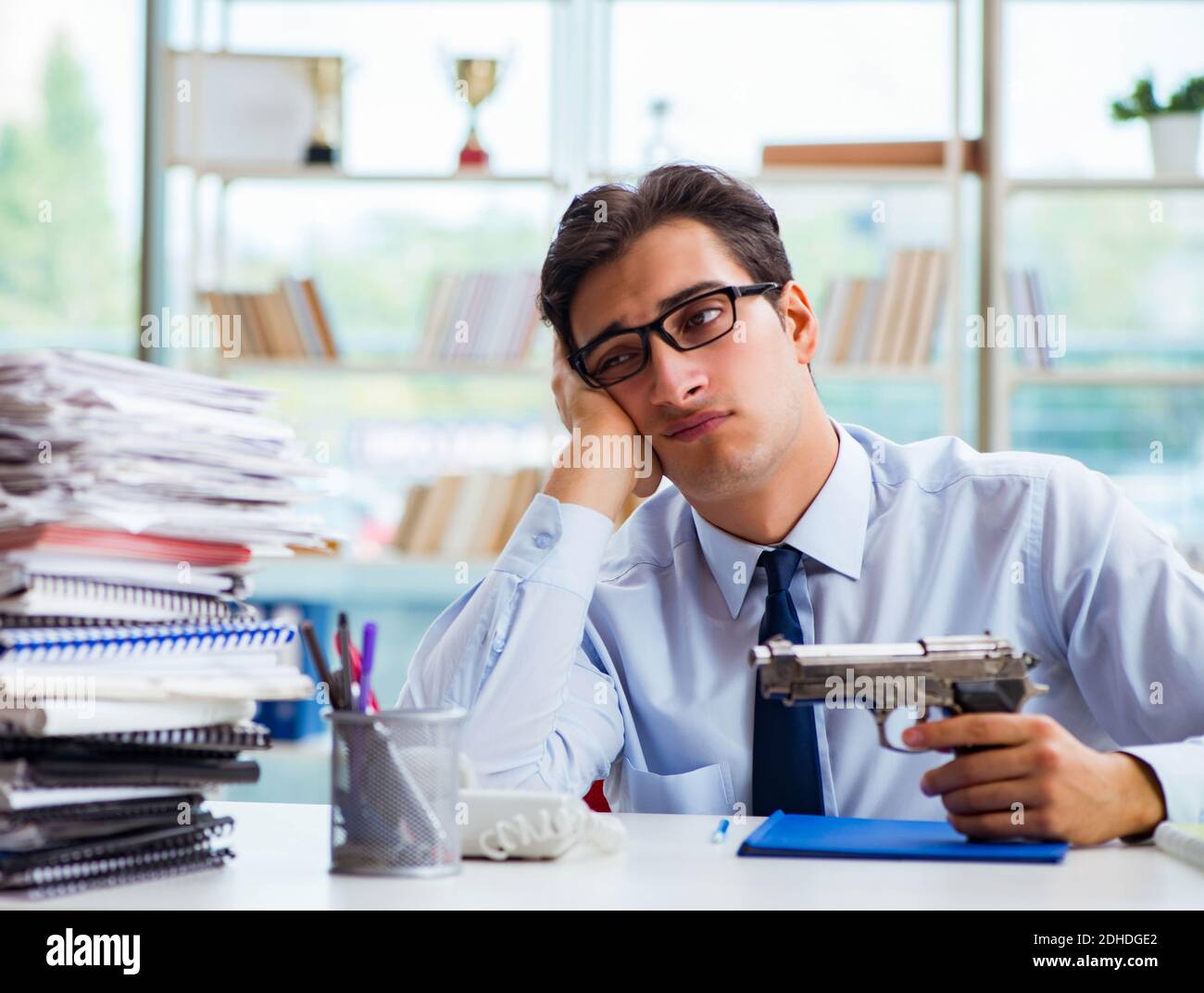 Angry businessman with gun thinking of committing suicide Stock Photo ...