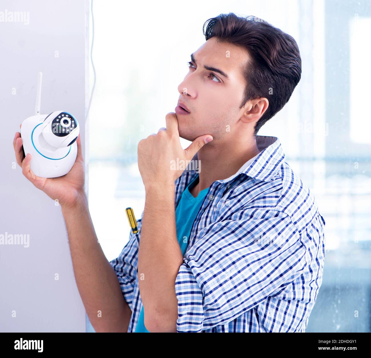 Security surveillance technician adjusting cctv hi-res stock ...