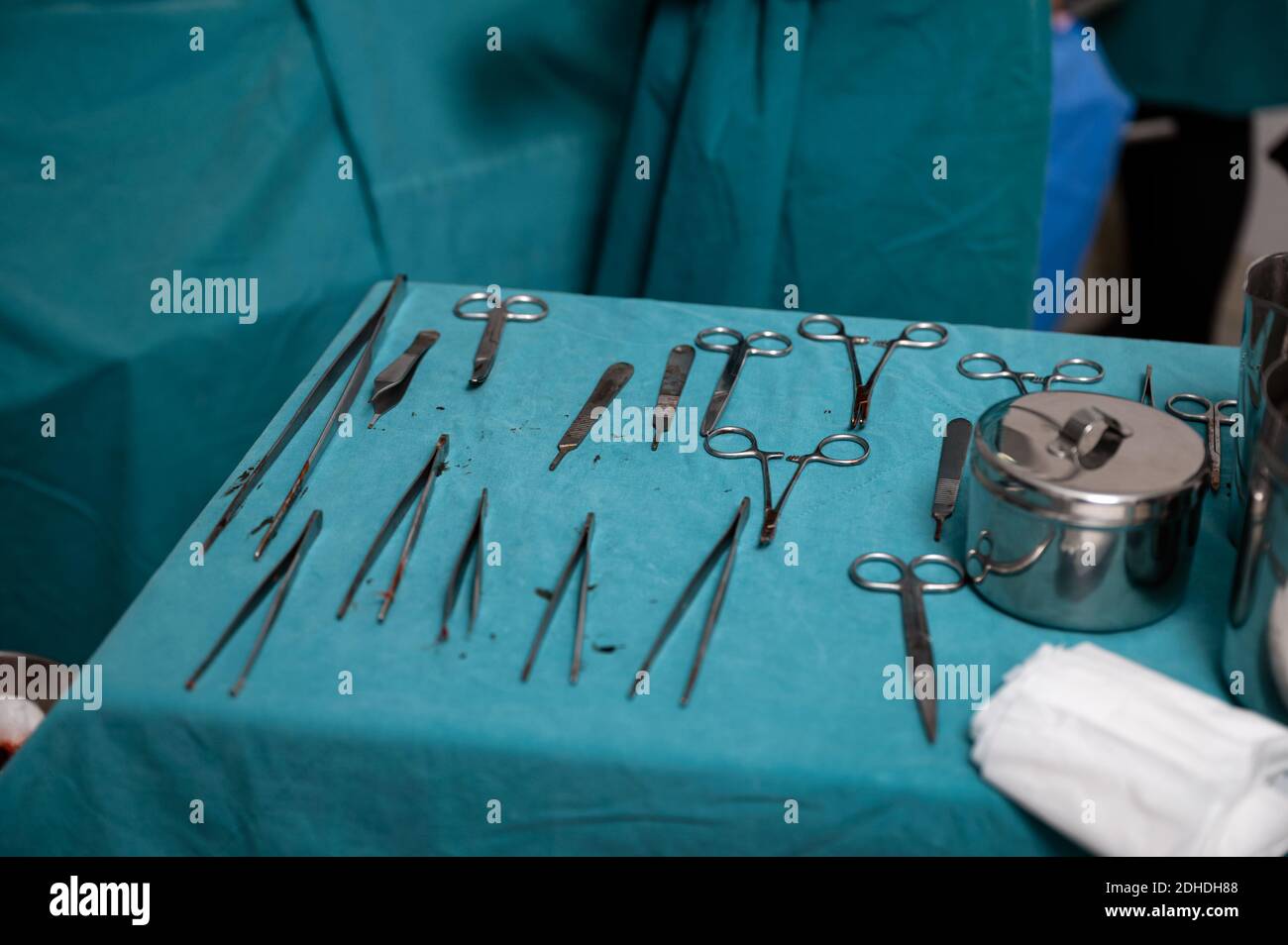 Surgical instruments with scalpels, forceps, scissors and tweezers on a ...
