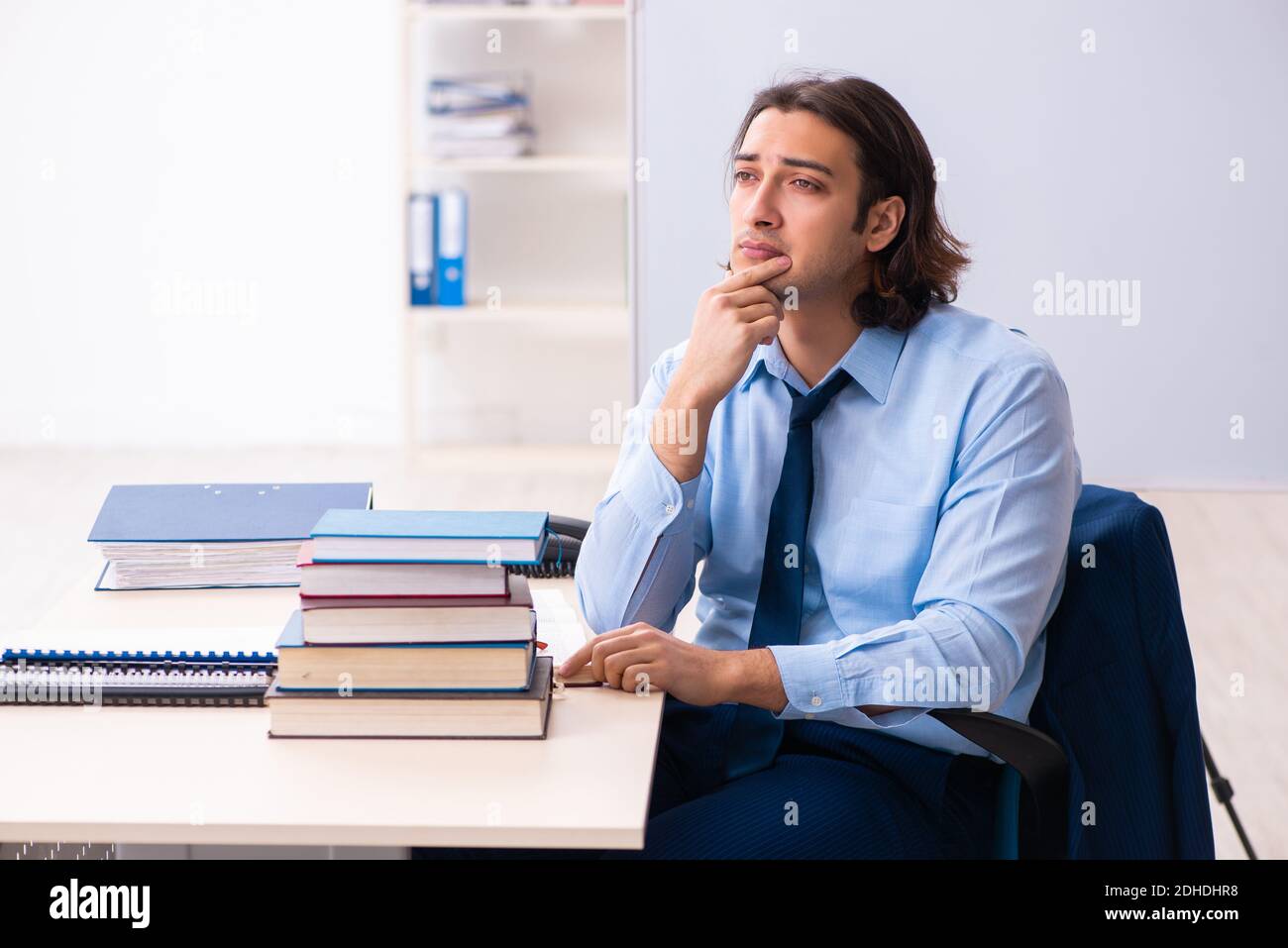 Young businessman student studying at workplace Stock Photo - Alamy