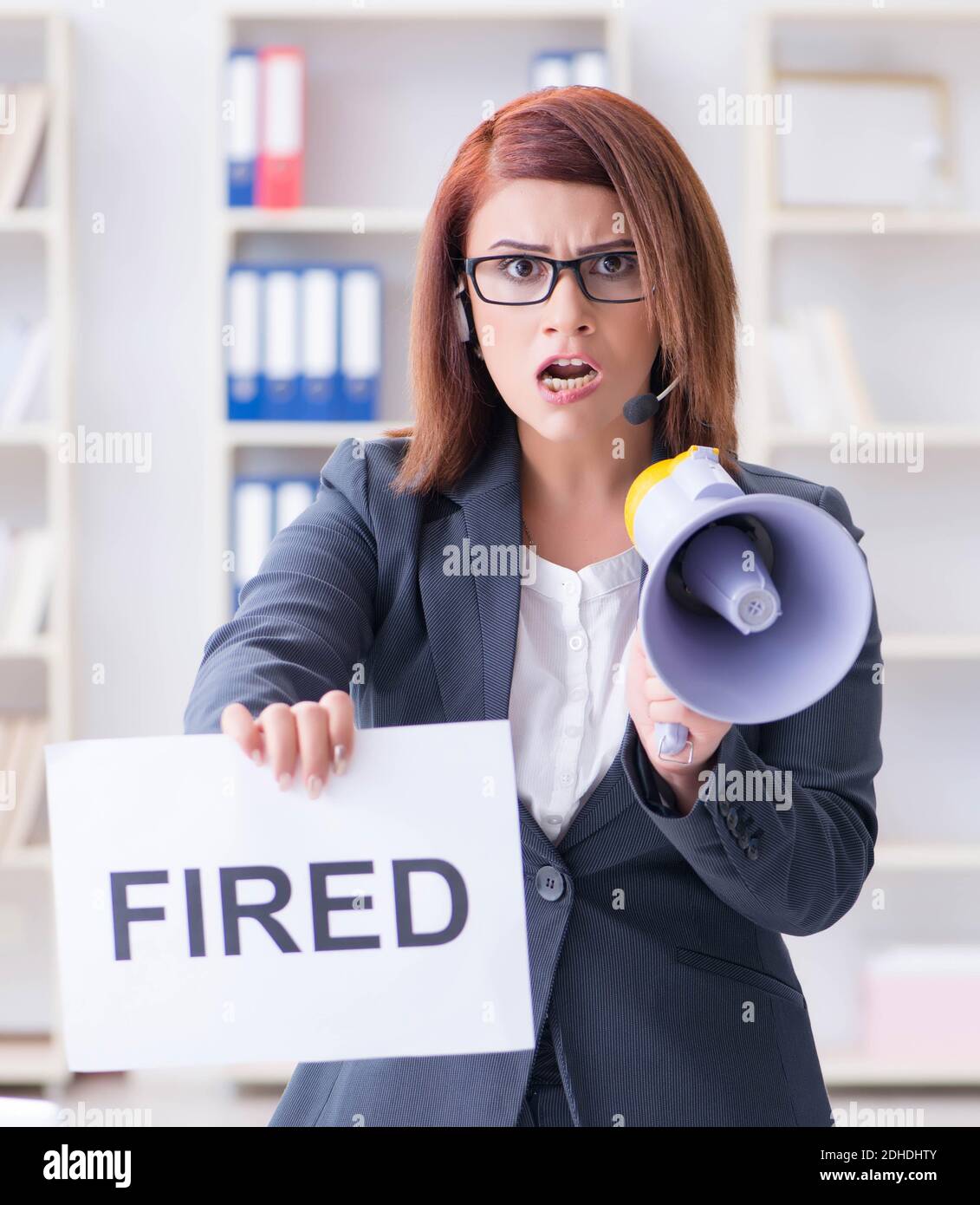 Businesswoman firing people in office Stock Photo - Alamy
