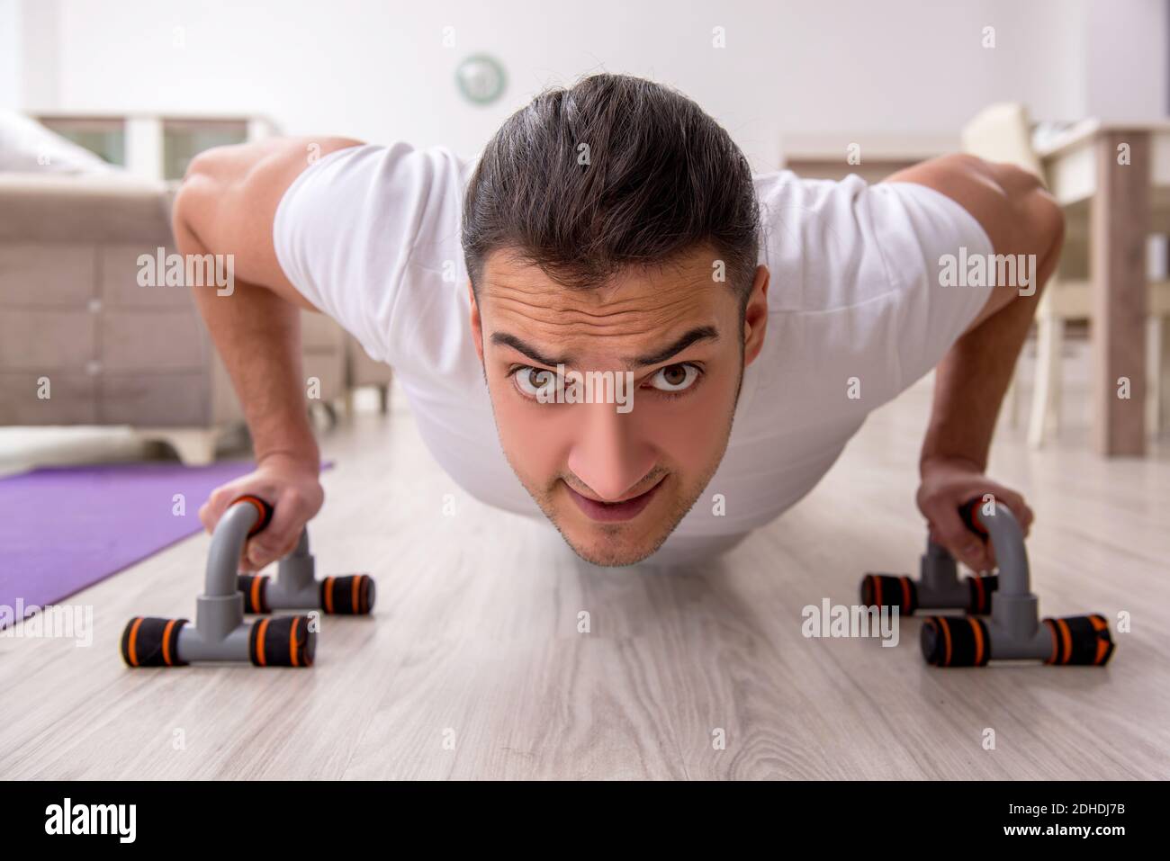 Young male starting day with morning exercises Stock Photo - Alamy