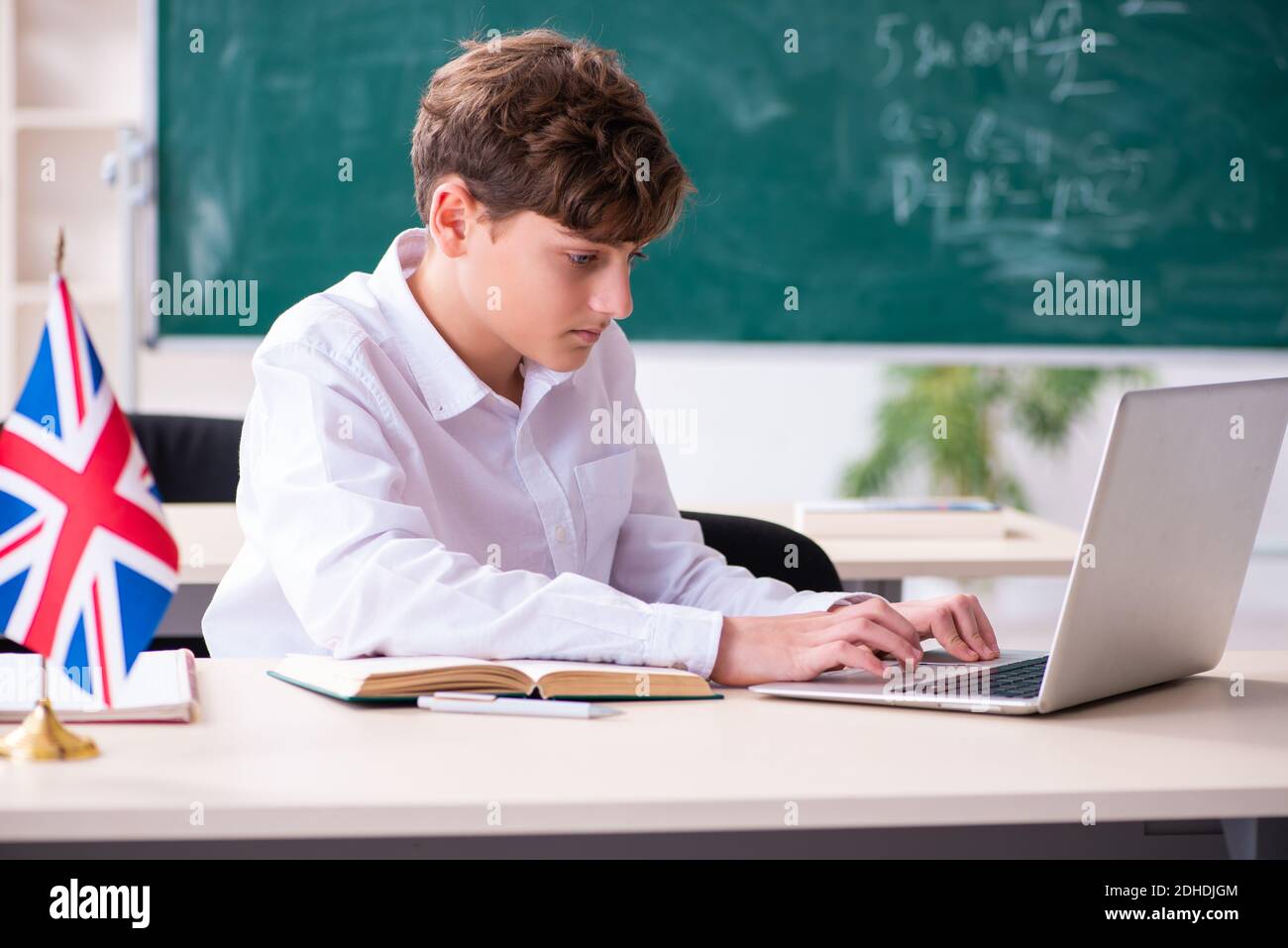 Schoolboy learning english language via Internet Stock Photo - Alamy