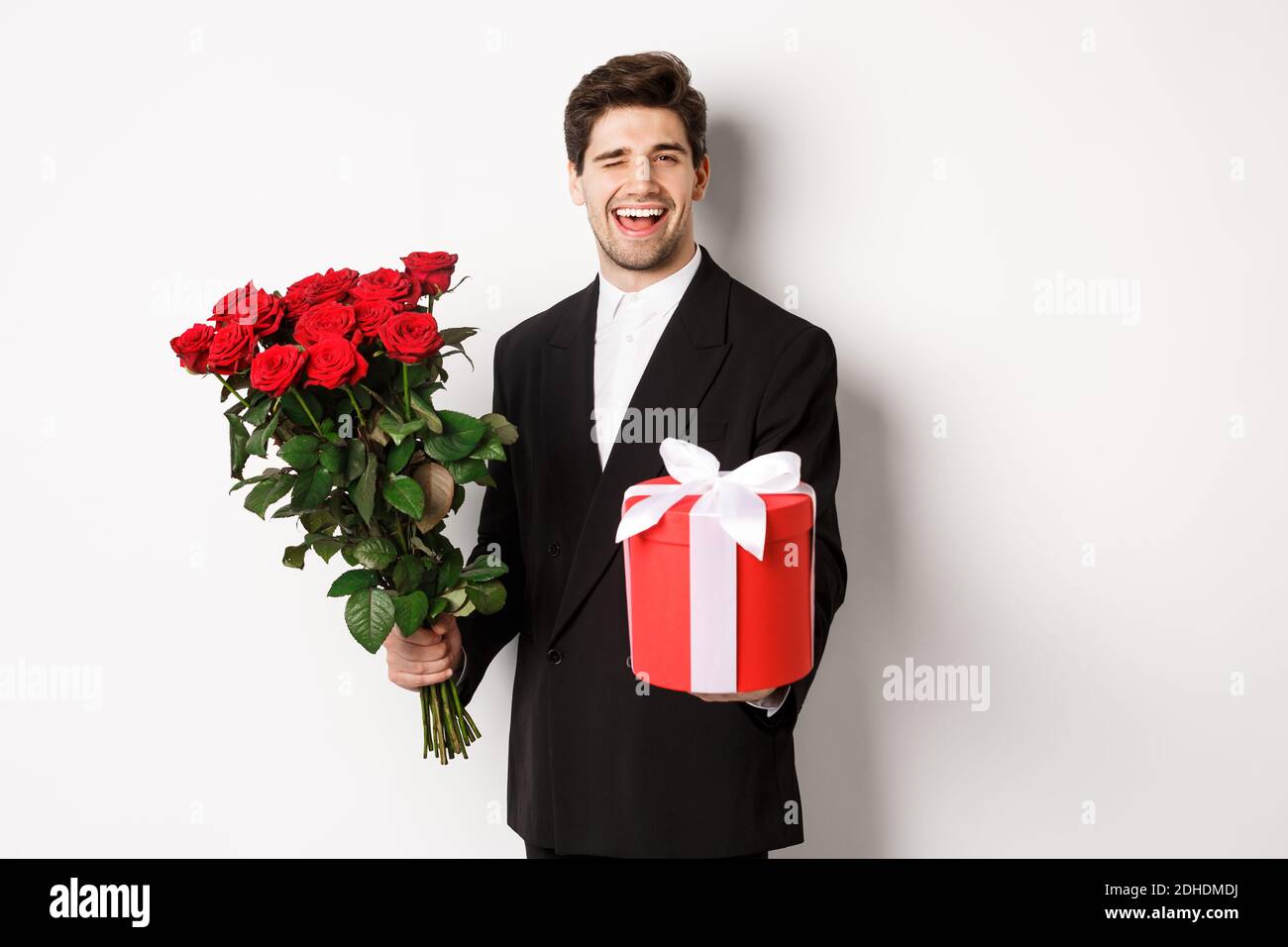 Concept of holidays, relationship and celebration. Charming young man ...