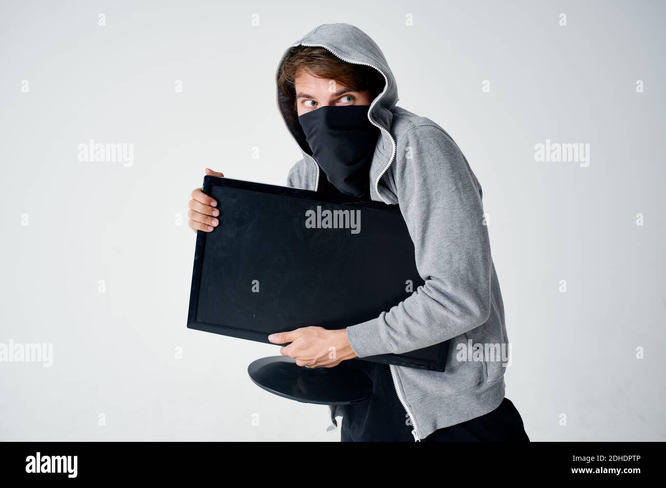 masked man with hood steals monitor technician hacker marking Stock ...