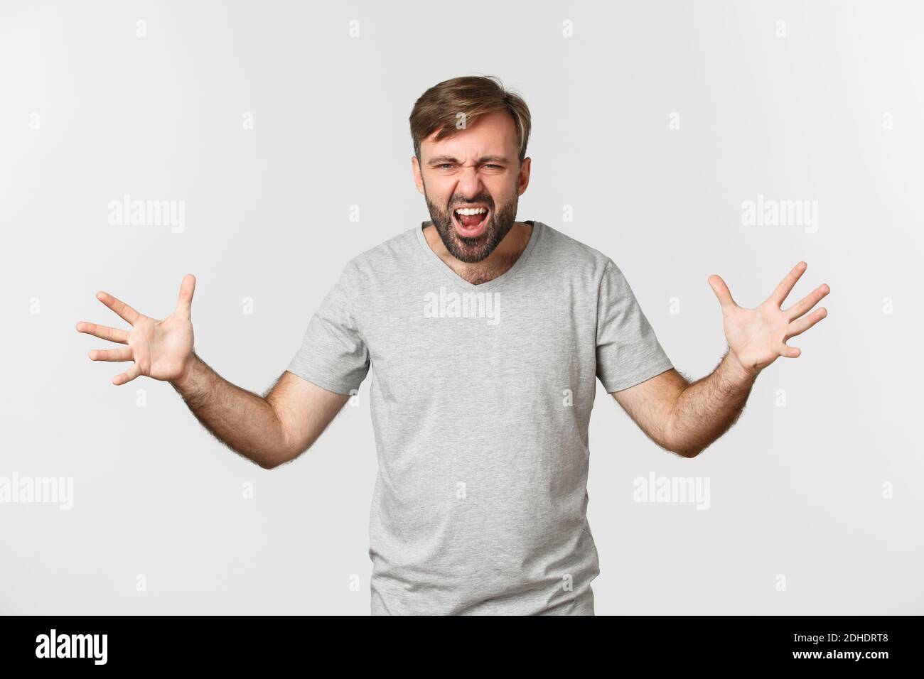Portrait of angry bearded man, shouting and shaking hands frustrated ...